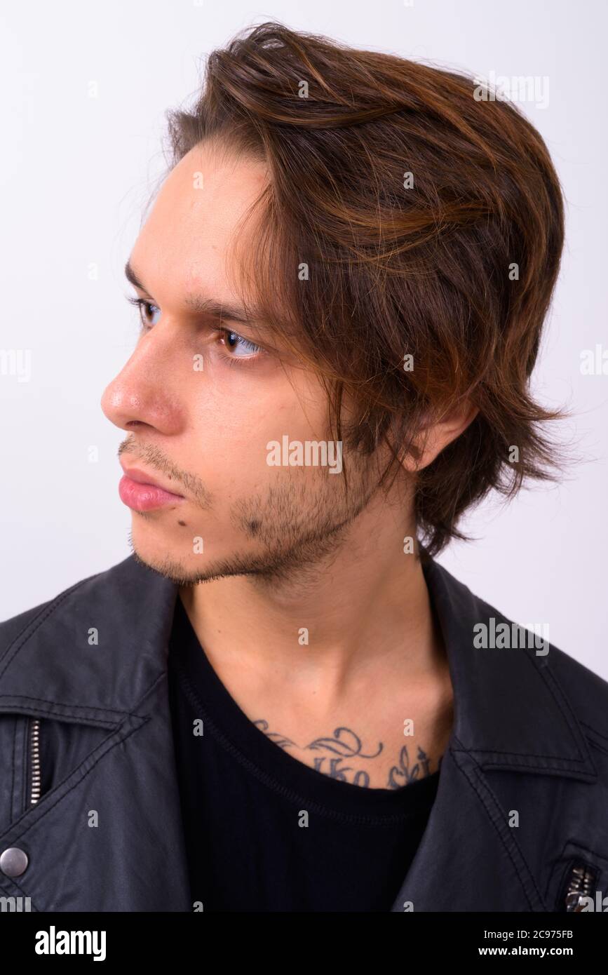 Young handsome rebellious man against white background Stock Photo - Alamy