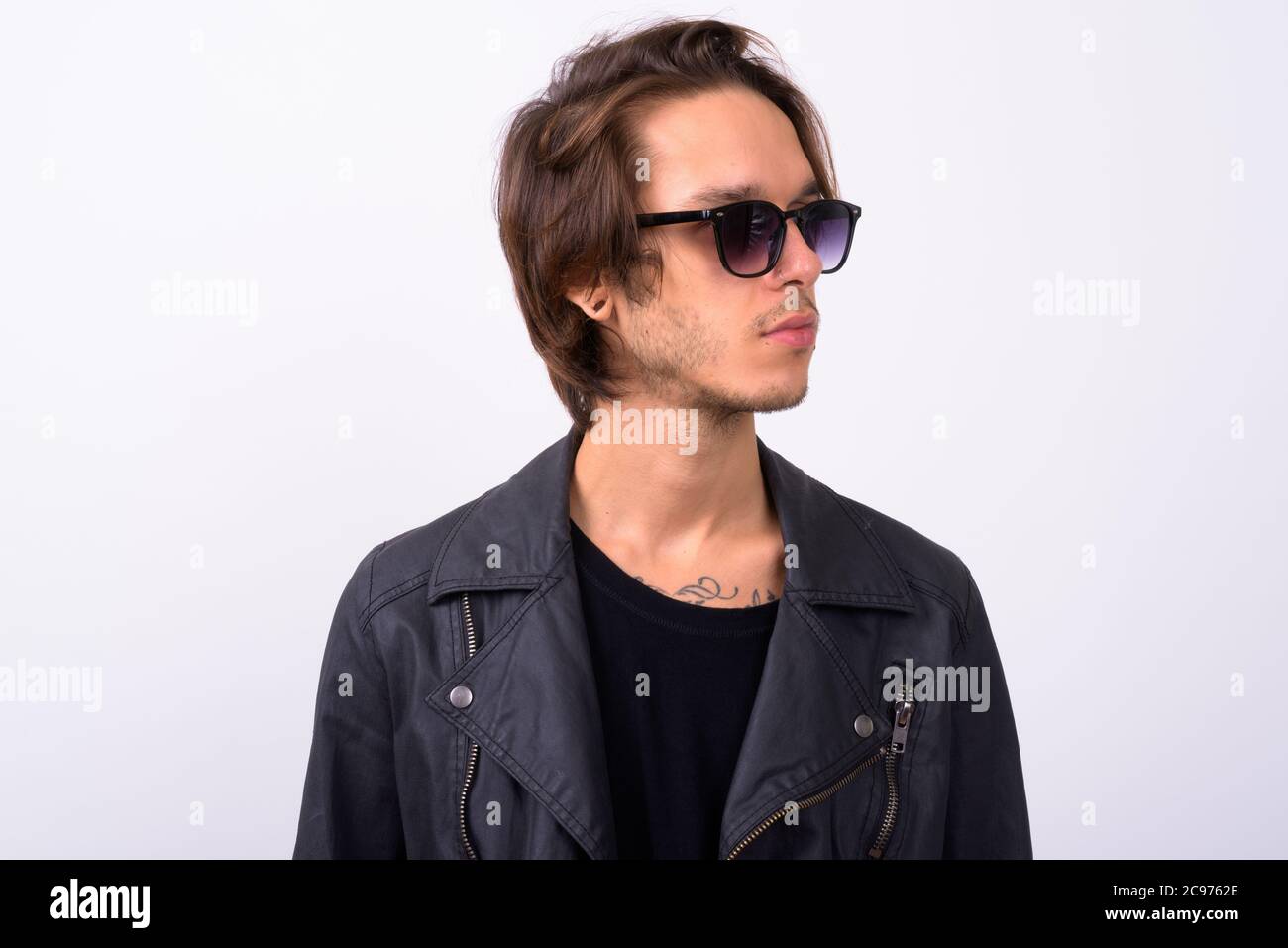 Young handsome rebellious man against white background Stock Photo - Alamy