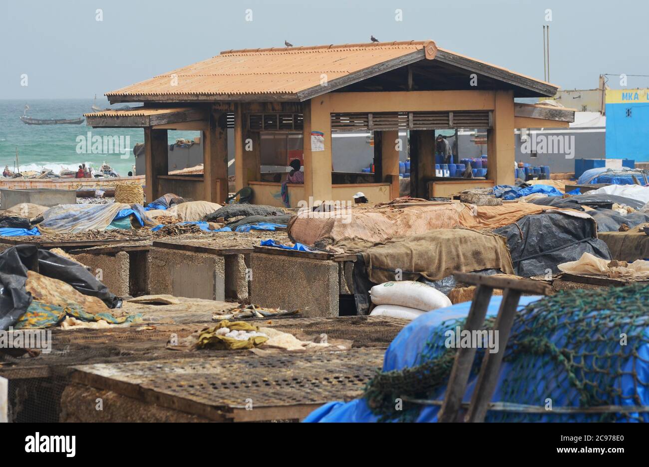 Traditional fish processing in west africa hi-res stock photography and ...