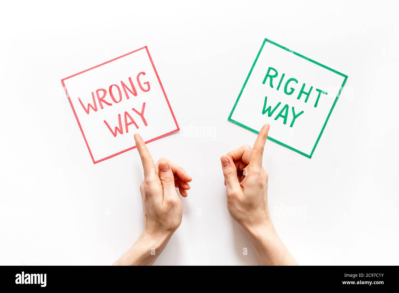 Choice concept. Right and wrong way icons, female hands shows top view ...