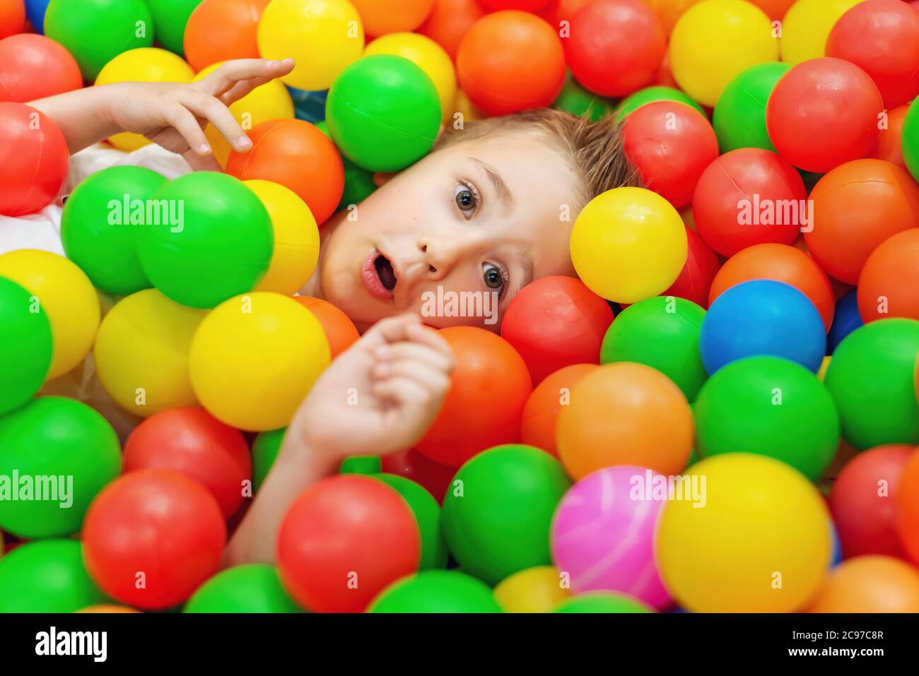 Boy playing and having a good time in kids zone Stock Photo - Alamy