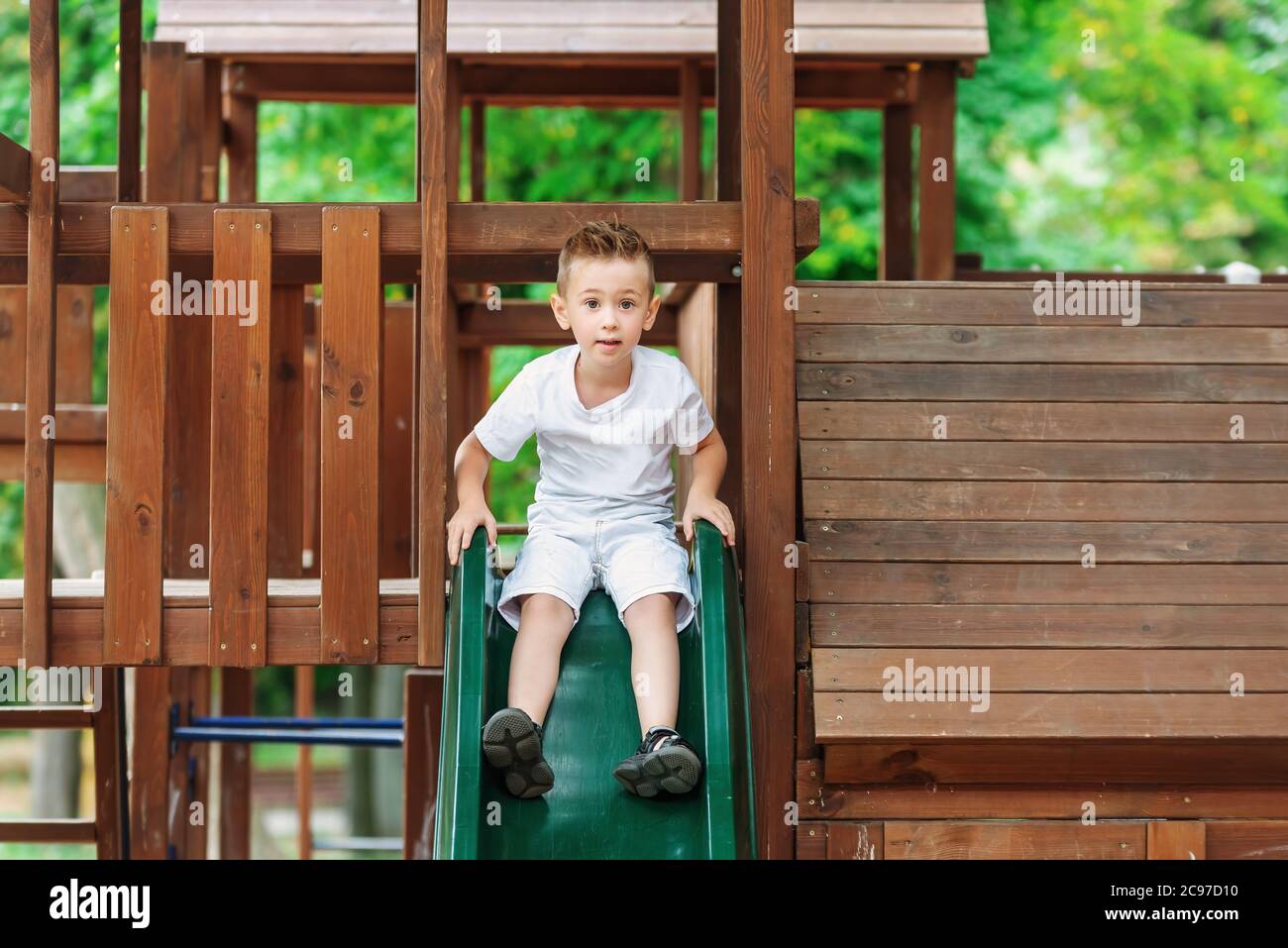 Child standing alone in playground hi-res stock photography and images ...