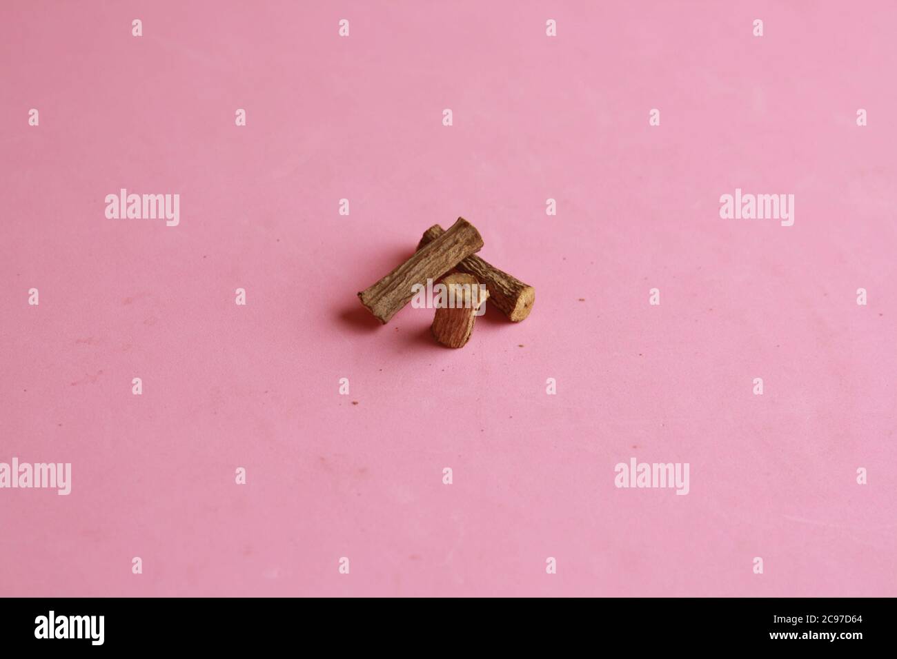 Closeup shot of small branch pieces on a pink background Stock Photo ...