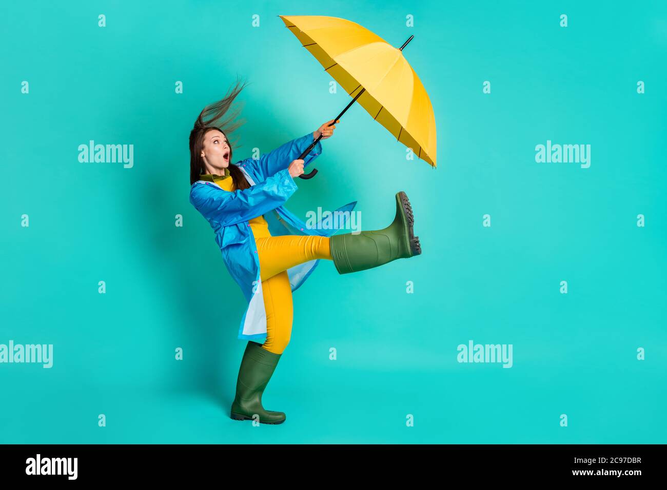 Full length profile photo of shocked lady stormy rainy weather walk ...