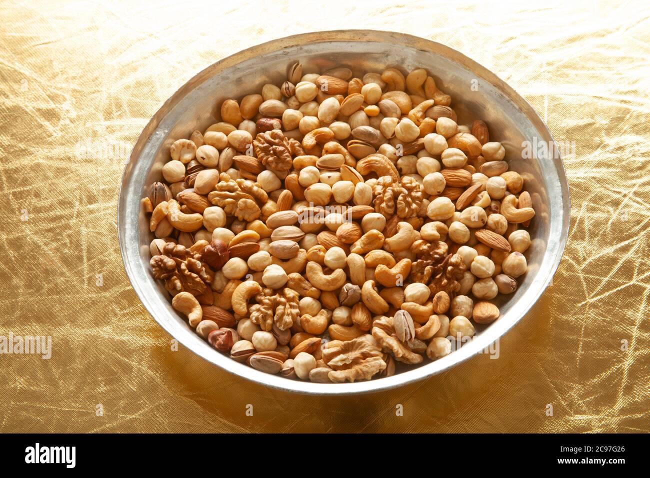 mixed nuts in copper plate Stock Photo - Alamy