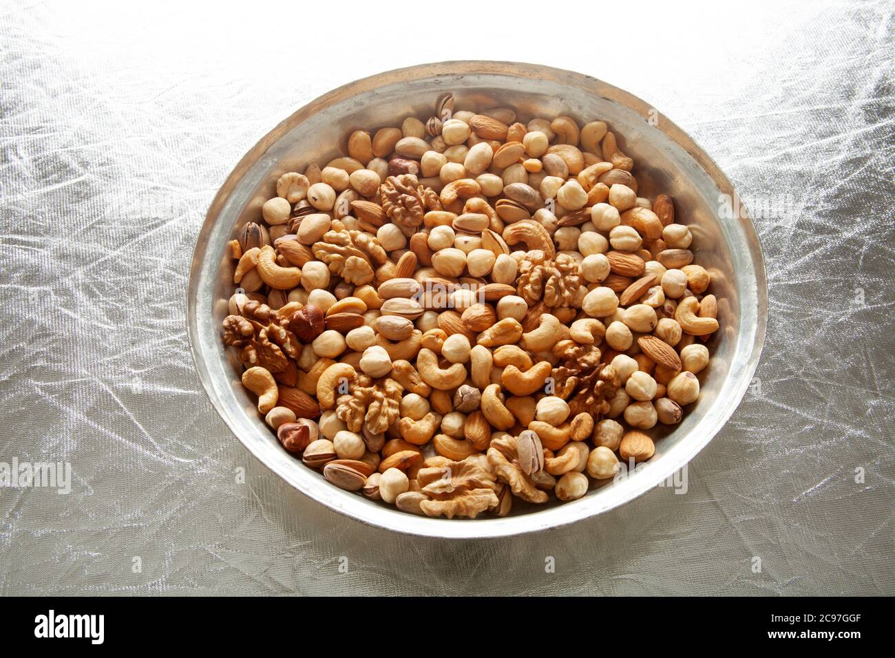 mixed nuts in copper plate Stock Photo - Alamy