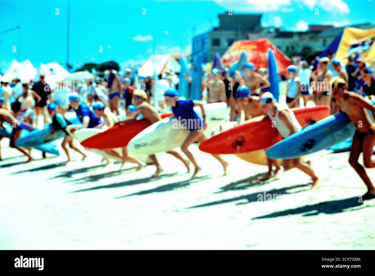 Teenage surfers at the starting line on competition day on a hot Bondi ...