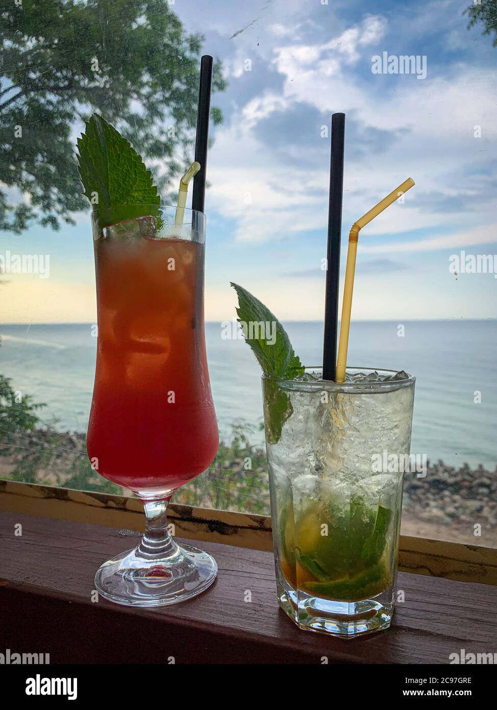 two cocktails stand side by side and in the background is the M Stock ...