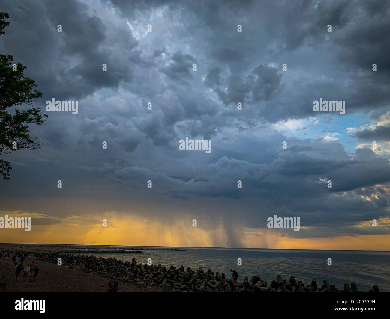 over the Baltic Sea is a storm with dark clouds and rain Stock Photo ...