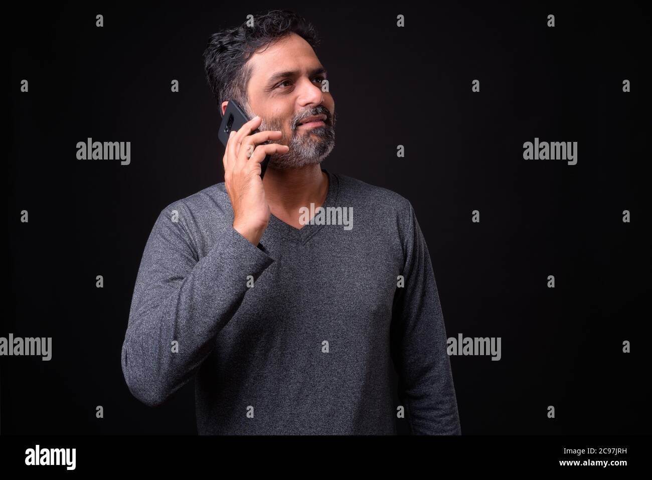 Portrait of mature bearded Indian man with curly hair Stock Photo - Alamy