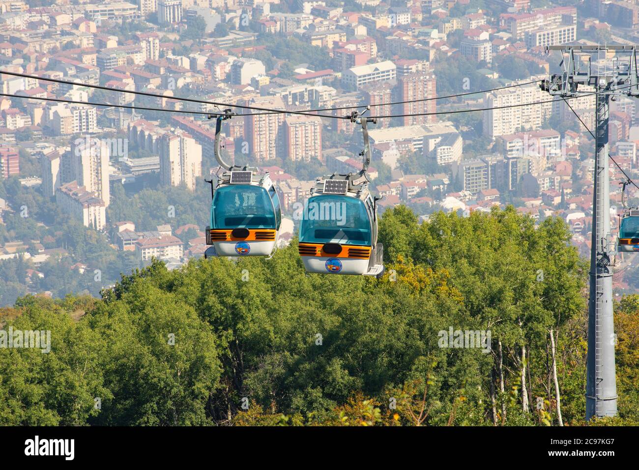 Cable car elevator with city view to Skopje in background. Gondola ...