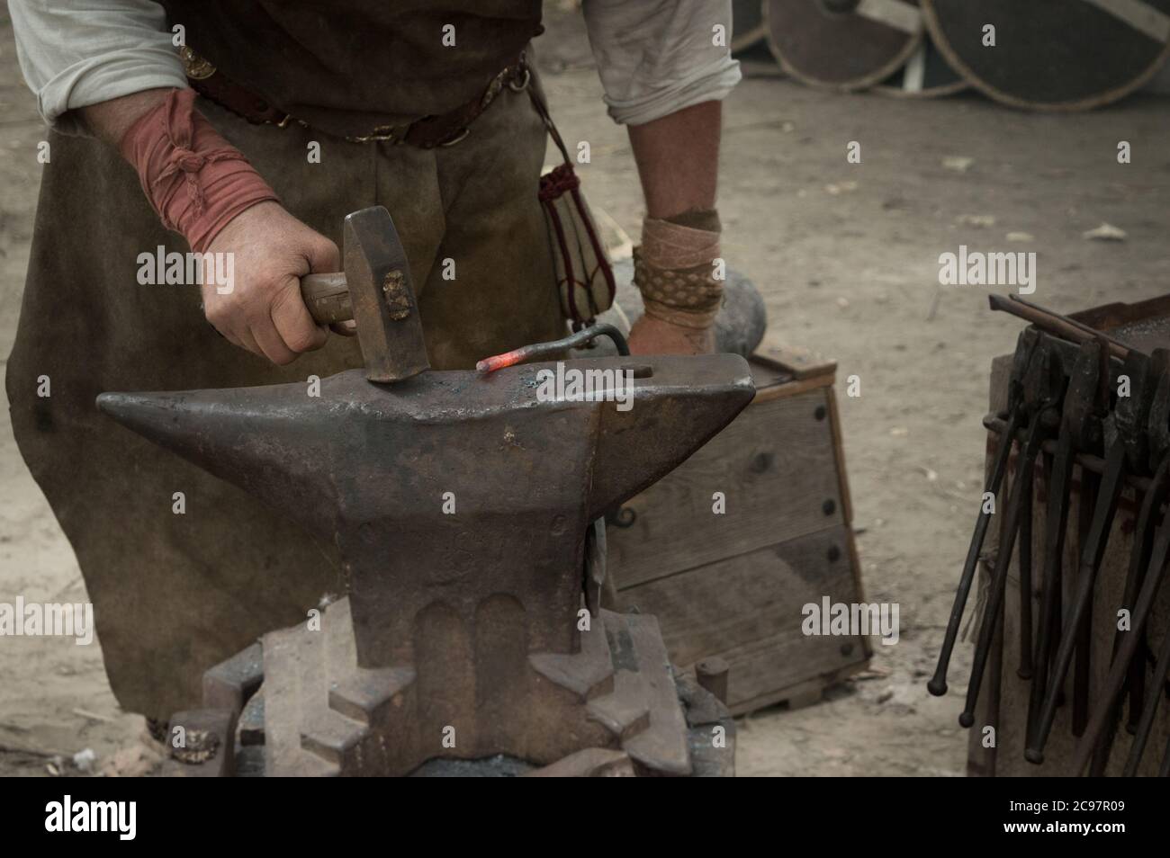 Closeup shot of a blacksmith working with hot iron Stock Photo - Alamy