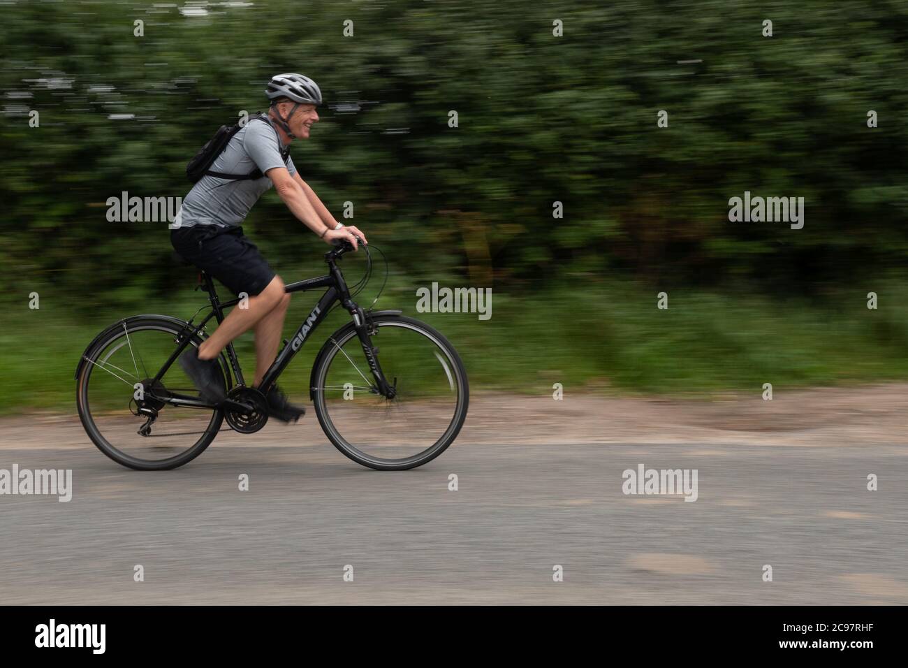 Man on bicycle in English countryside Stock Photo - Alamy