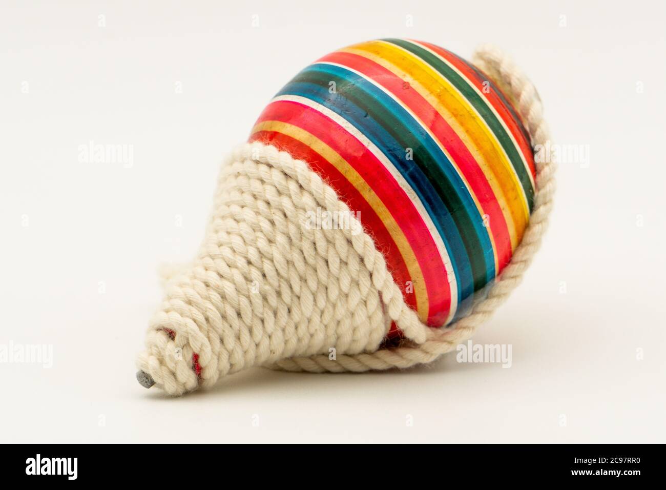 Colorful trompo on a white background Stock Photo - Alamy