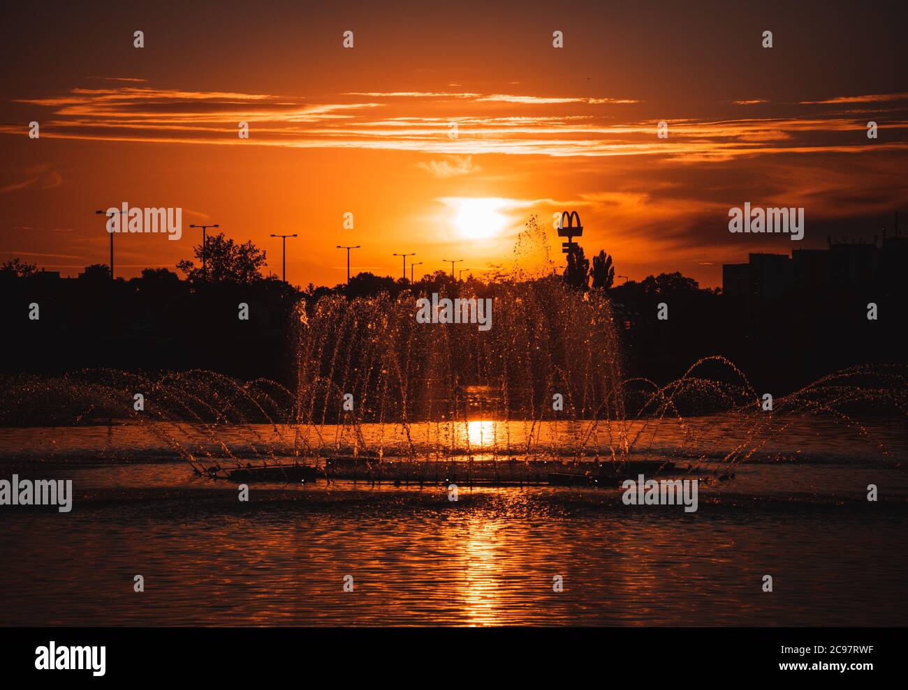Water fountain field sky sunset field hi-res stock photography and ...