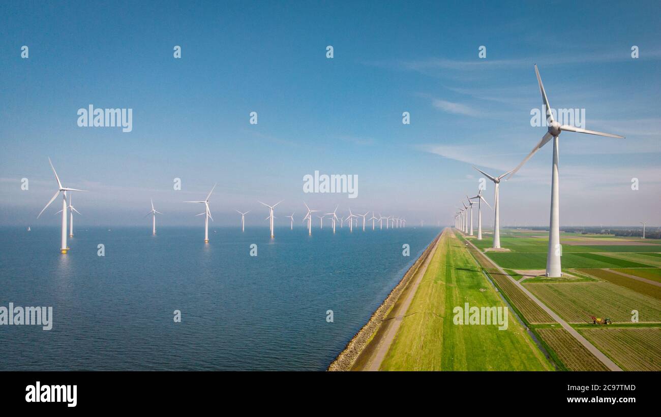 Windmill park westermeerdijk Netherlands, wind mill turbine with blue ...