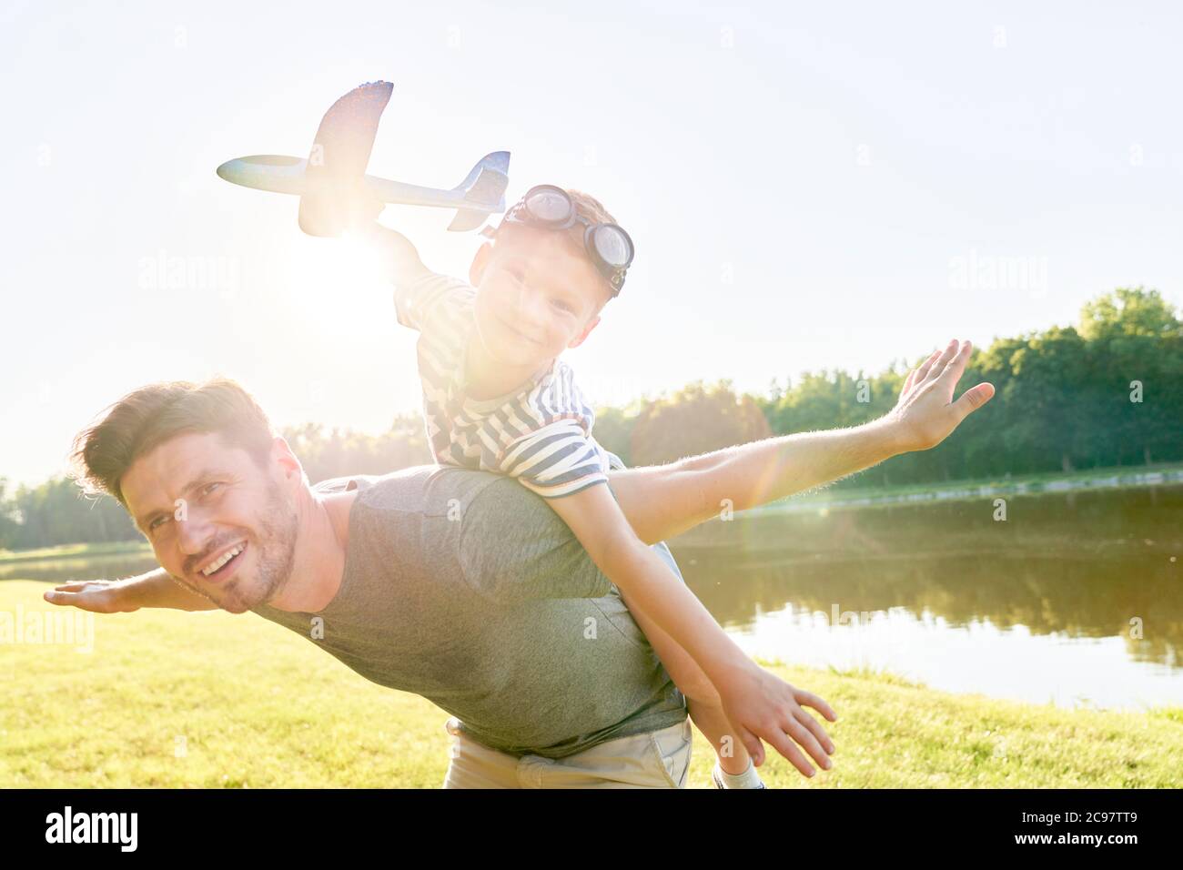 Father and son playing with a plane Stock Photo - Alamy
