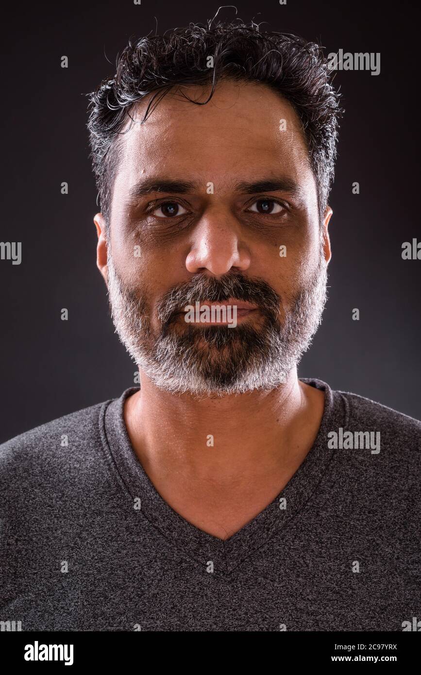 Portrait of mature bearded Indian man with curly hair Stock Photo - Alamy