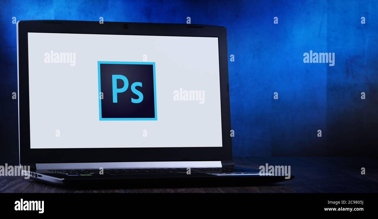 POZNAN, POL - JUL 14, 2020: Laptop computer displaying logo of Adobe ...