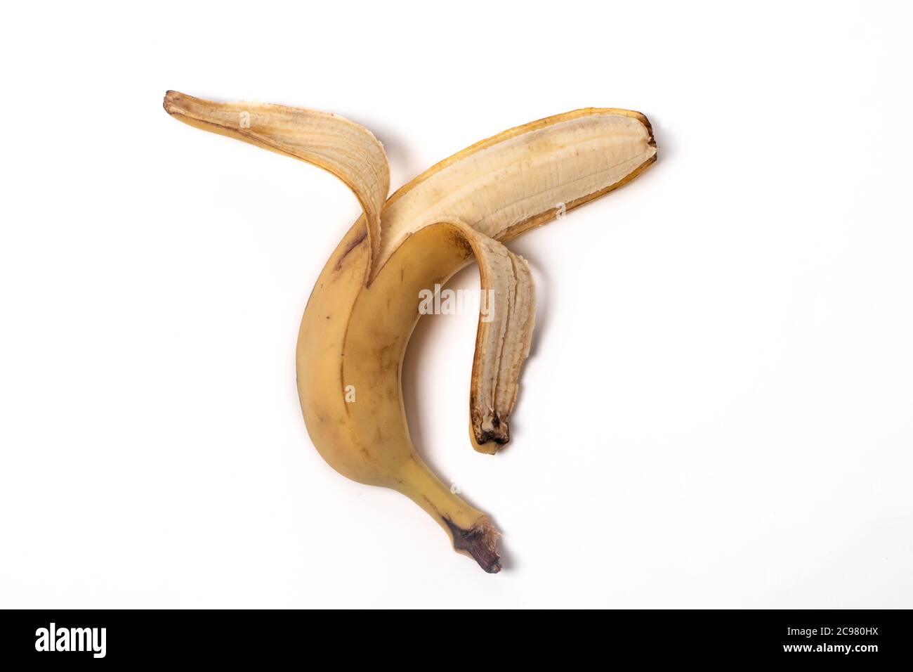 One ripe peeled banana on a white background. The banana pulp Stock ...