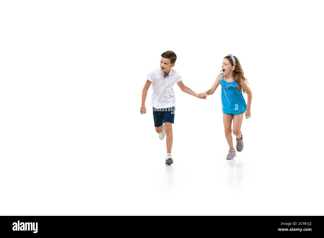 Happy kids, little and emotional caucasian boy and girl jumping and ...