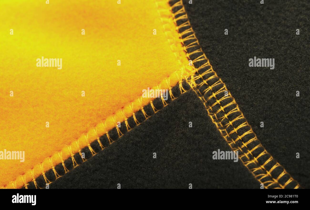 Yellow gray fleece jacket seams, close up photo Stock Photo - Alamy