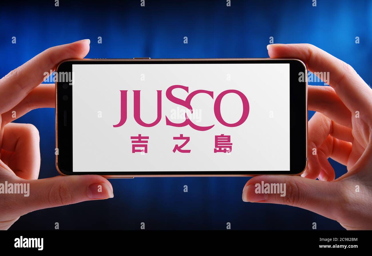 POZNAN, POL - MAY 21, 2020: Hands holding smartphone displaying logo of ...