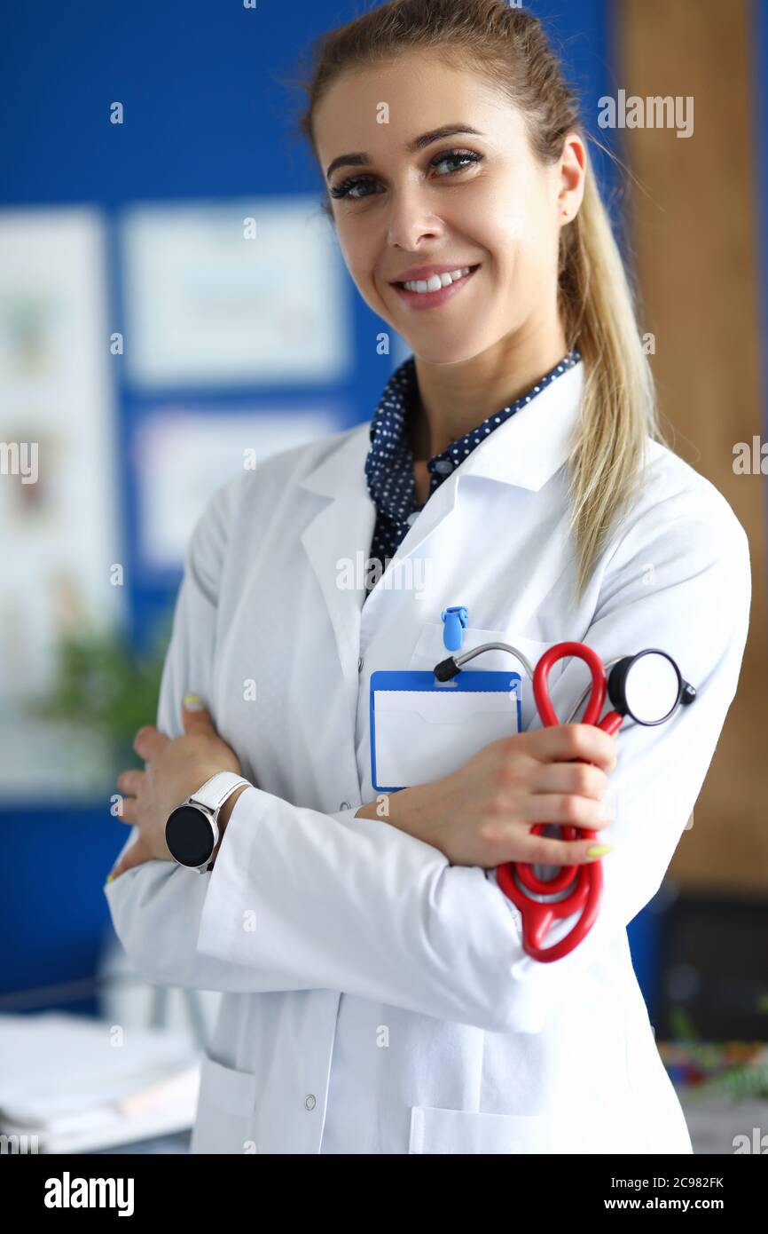 Woman doctor stands in the front desk of the clinic Stock Photo - Alamy
