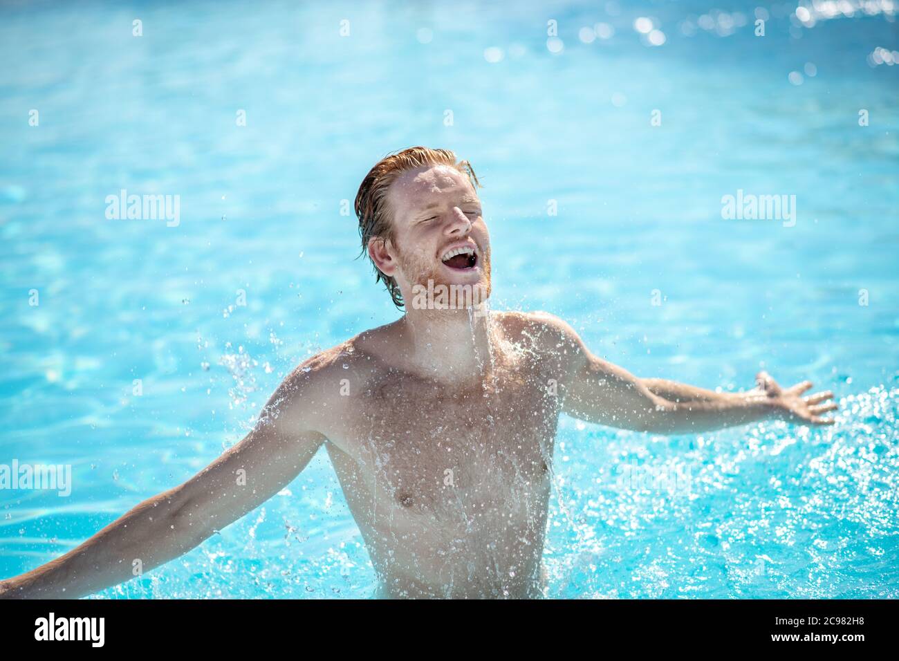 Rejoicing man in waist-deep water with closed eyes Stock Photo - Alamy