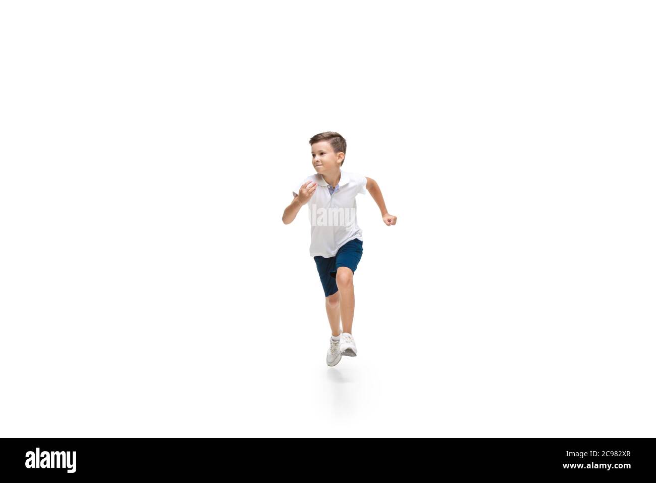 Happy kids, little and emotional caucasian boy jumping and running ...