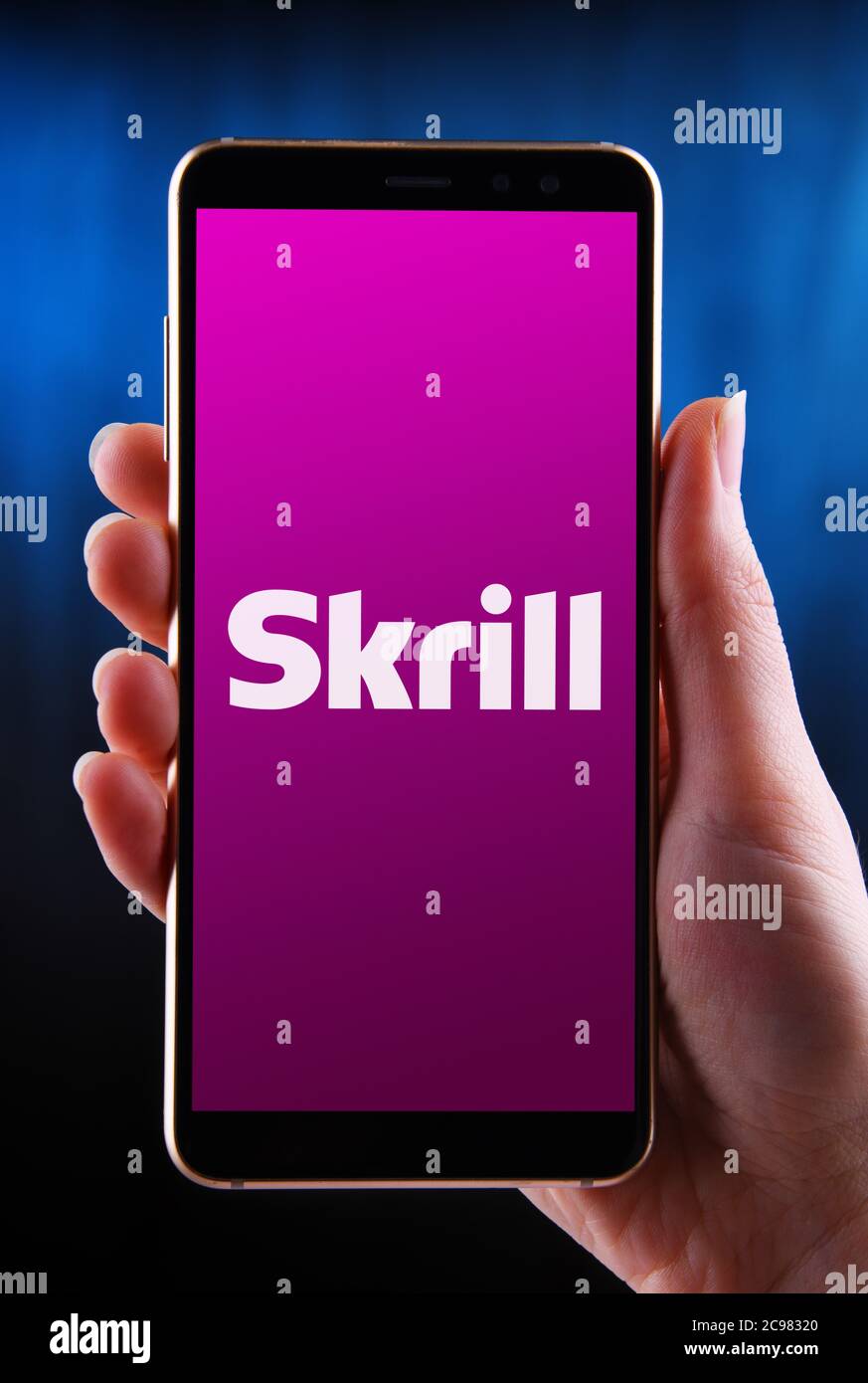 POZNAN, POL - MAY 21, 2020: Hands holding smartphone displaying logo of ...