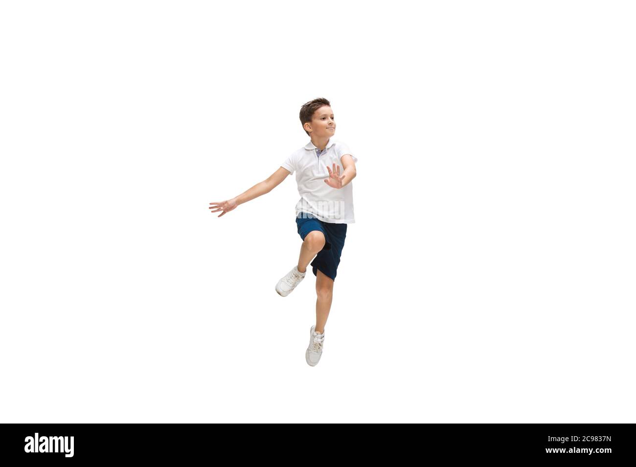 Happy kids, little and emotional caucasian boy jumping and running ...