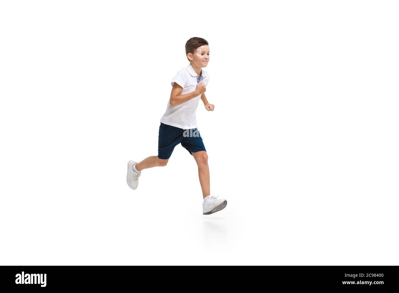 Happy kids, little and emotional caucasian boy jumping and running ...