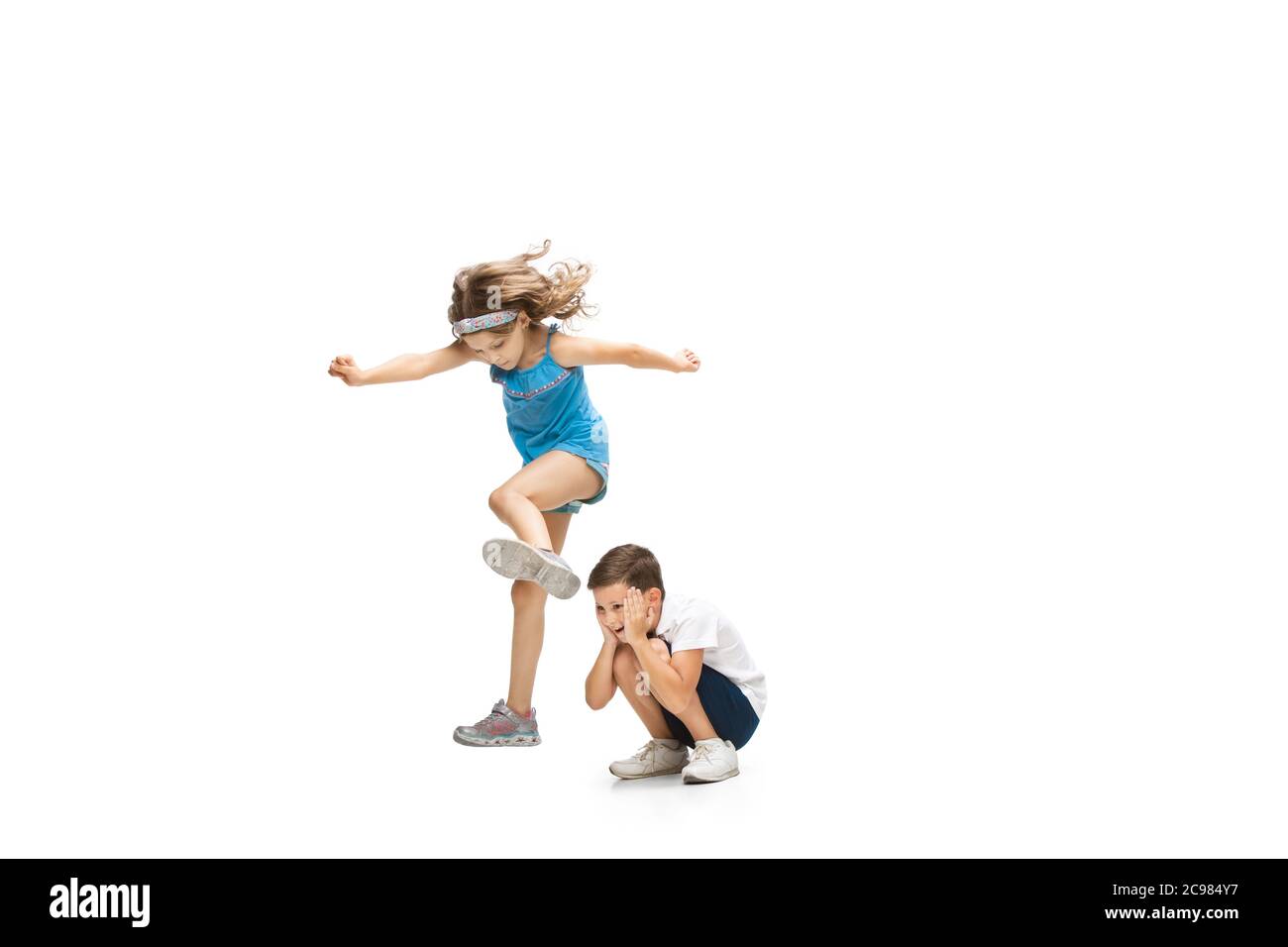 Happy kids, little and emotional caucasian boy and girl jumping and ...