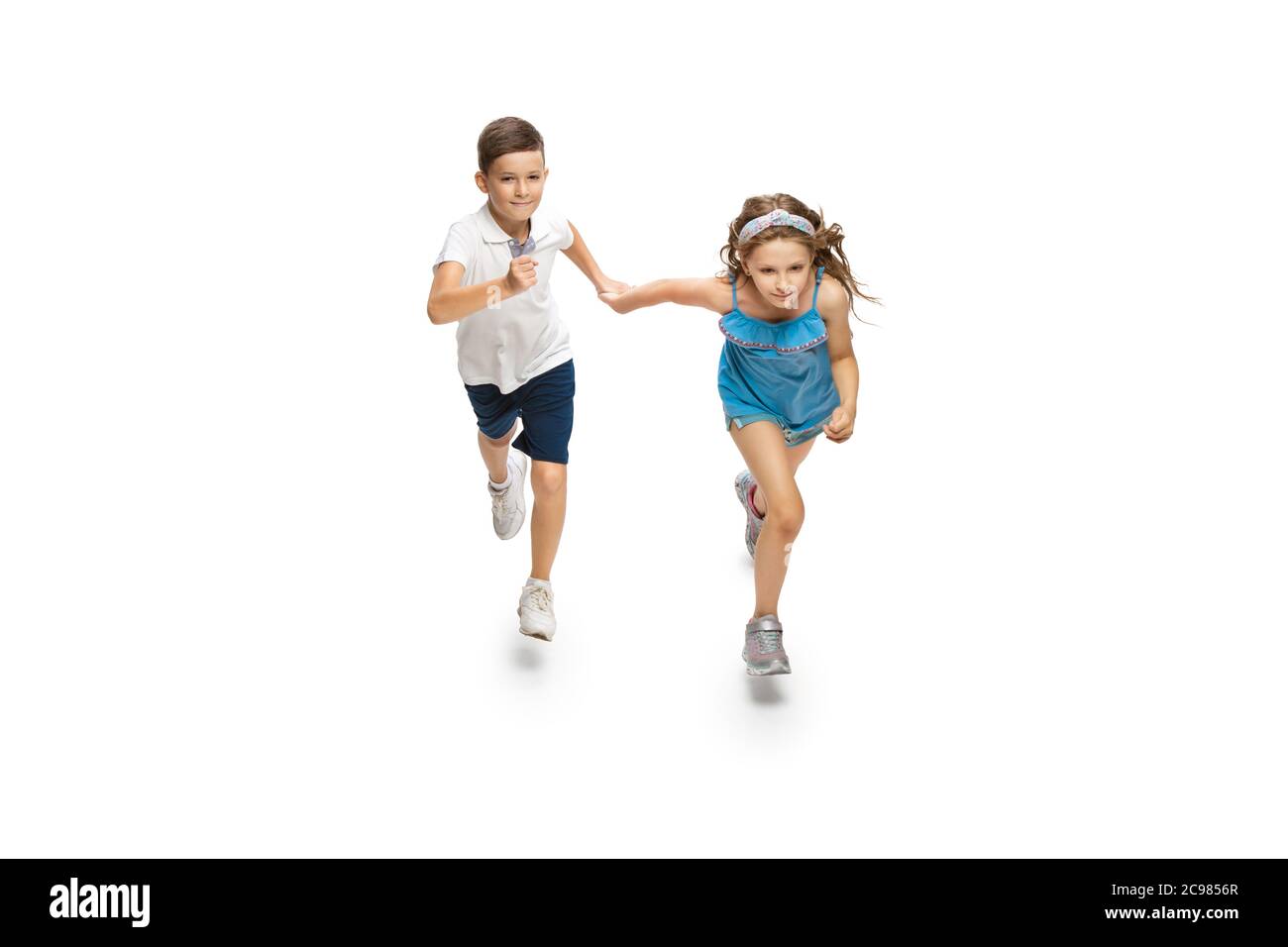 Happy kids, little and emotional caucasian boy and girl jumping and ...
