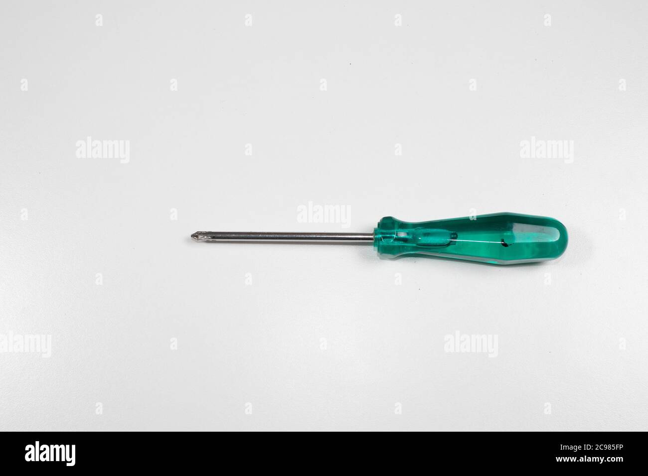 A typical Phillips screwdriver has a colored handle and on white ...