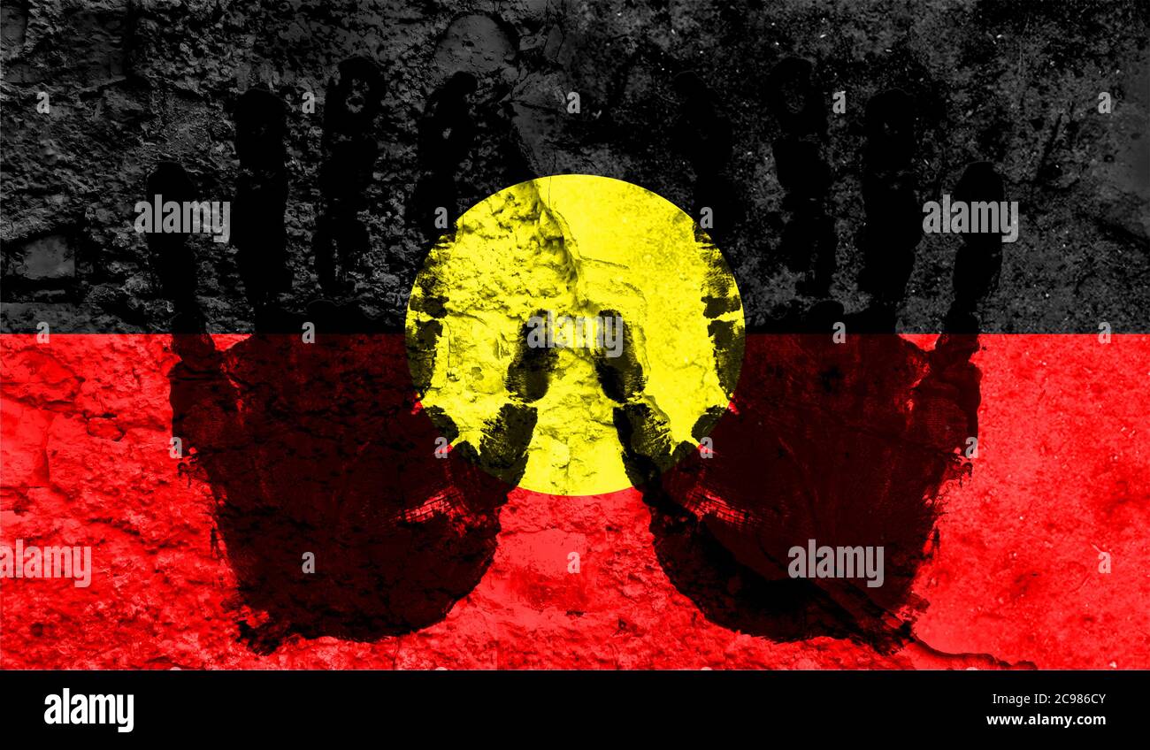 Handprints on the background of the flag of Australian Aboriginal ...