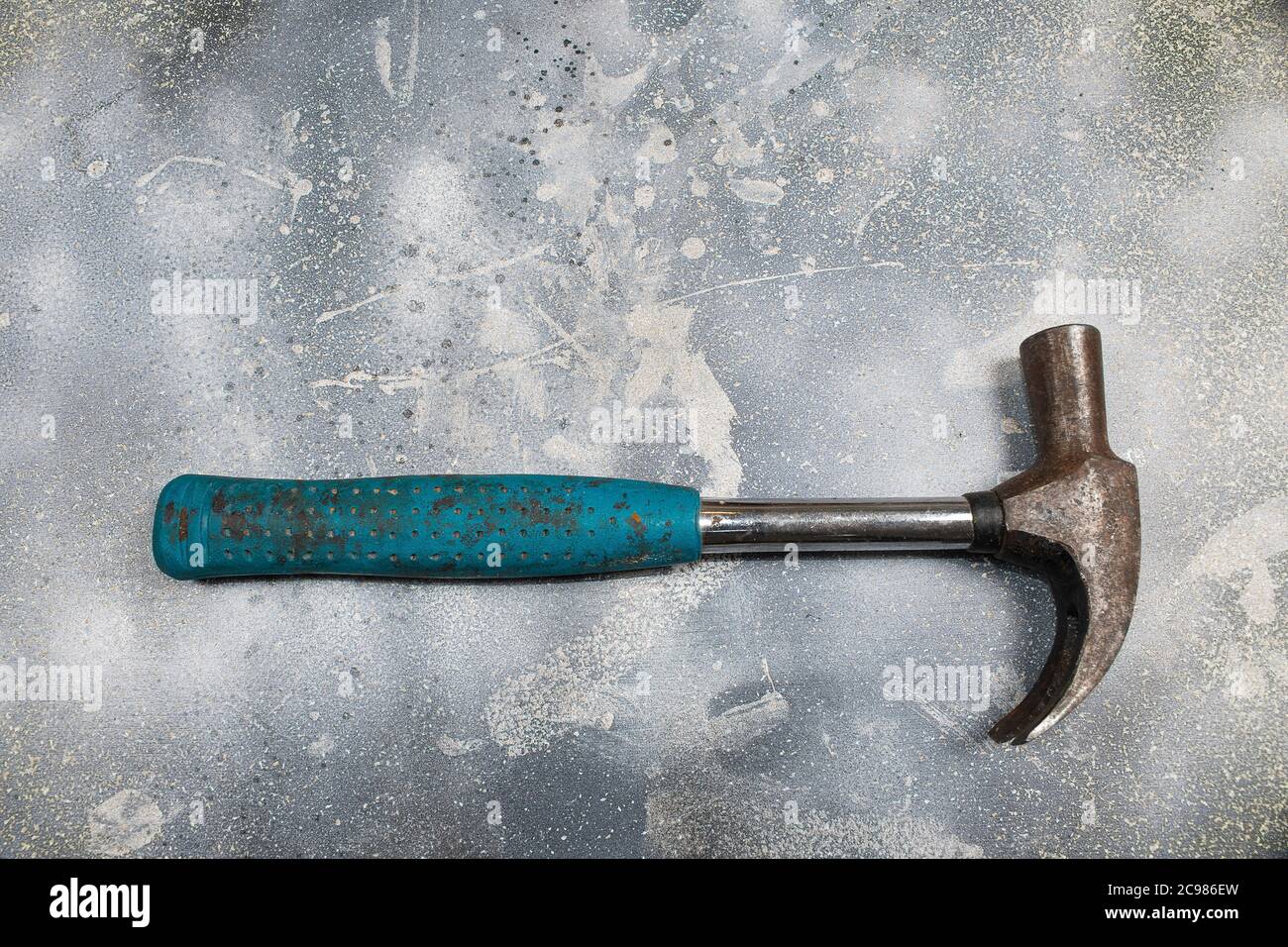 A iron metallic hammer, isolated on rustic grey background Stock Photo ...