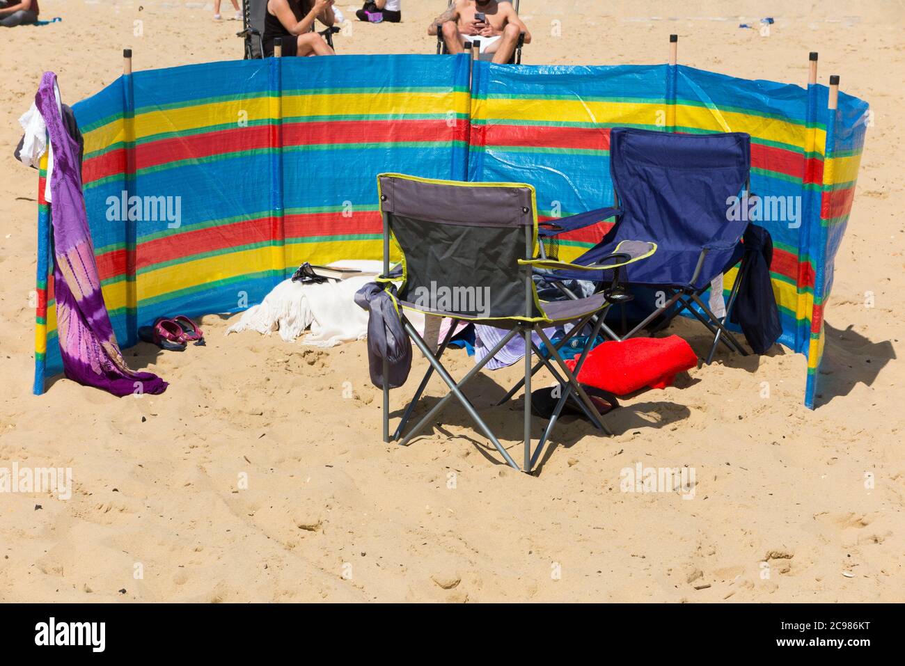 Windbreak / wind break erected by tourist family on a windy day on ...