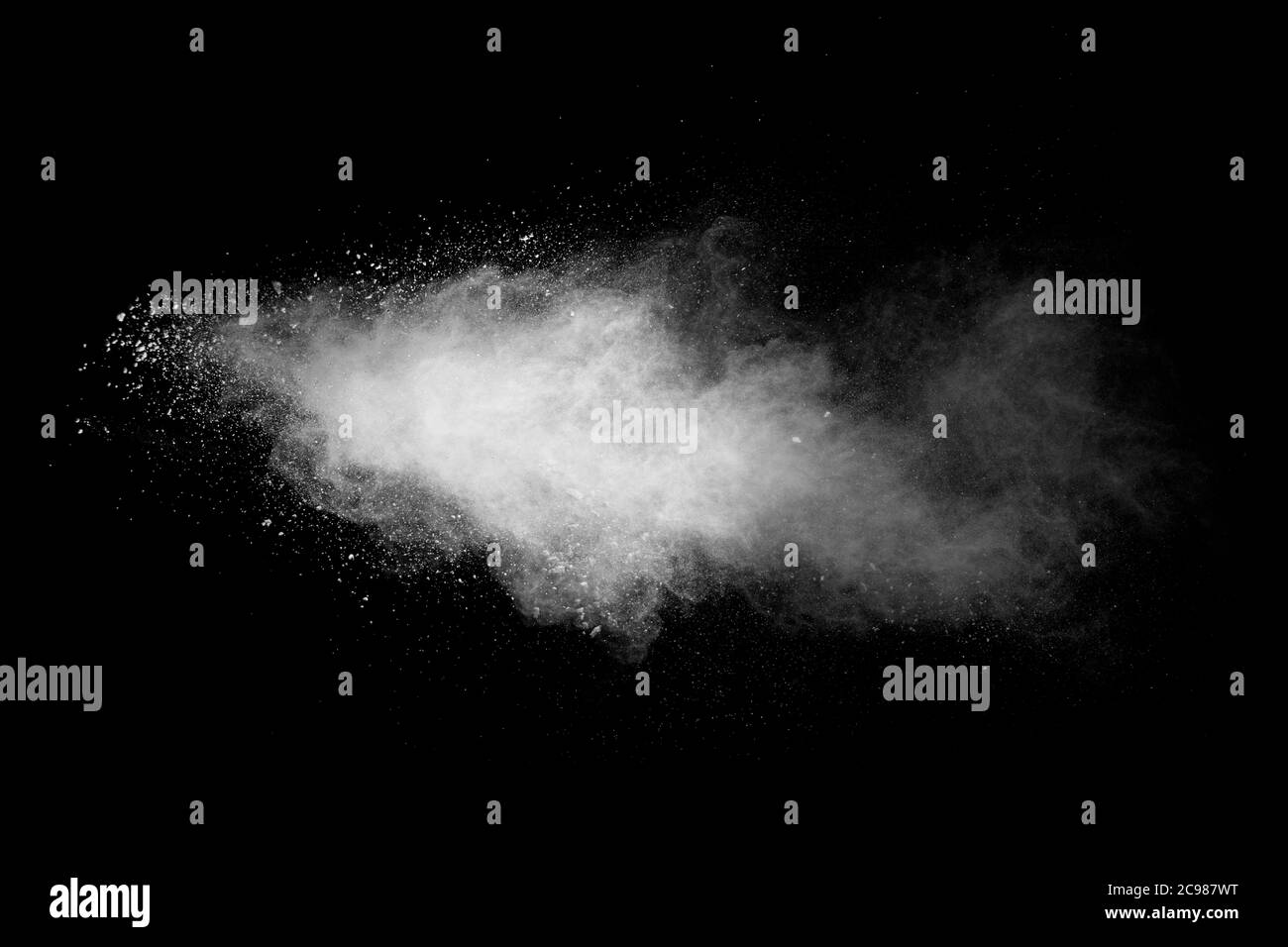 White powder explosion isolated on black background. White dust ...