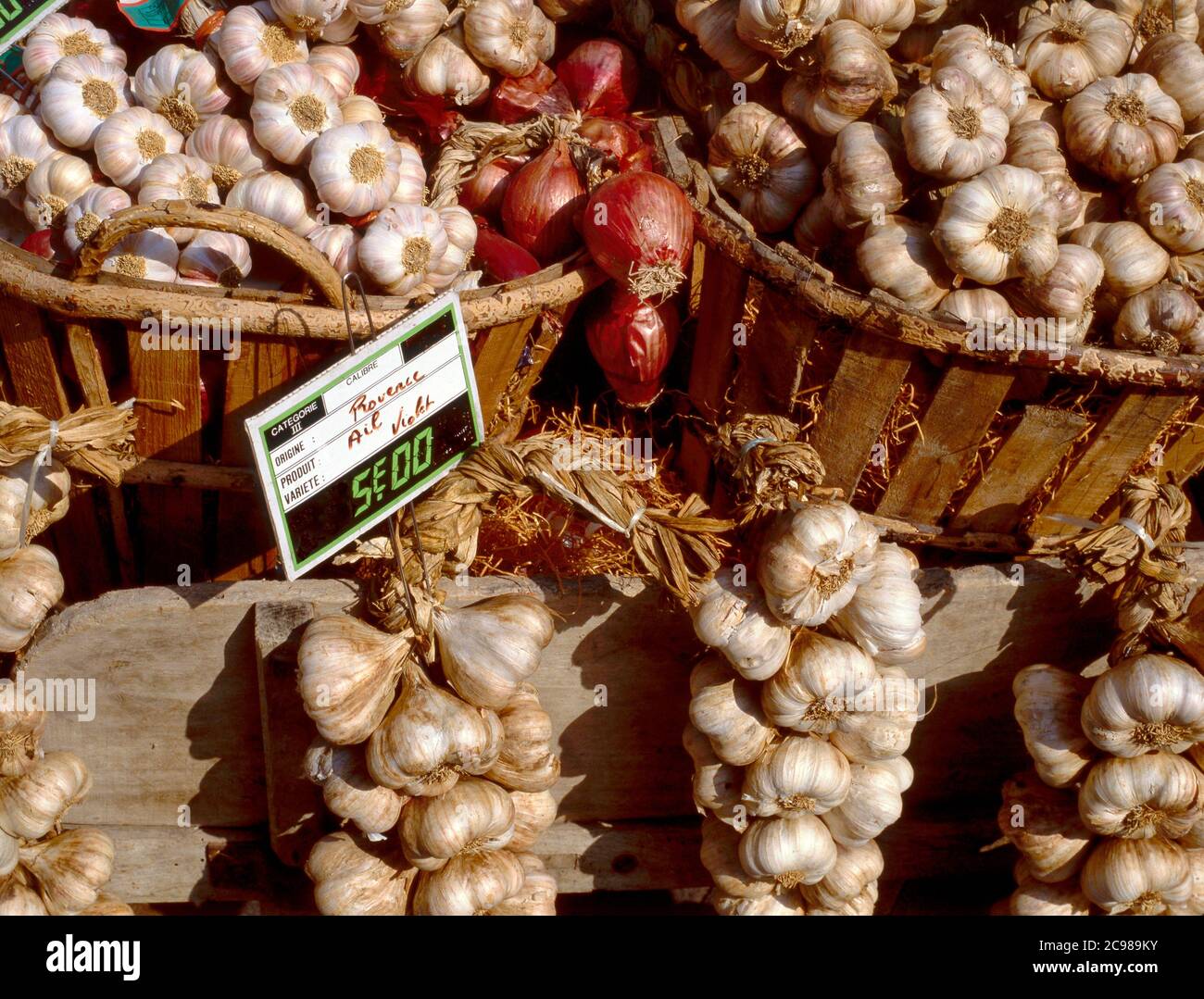 Purple garlic for sale at a farmers market in France, Europe Stock ...