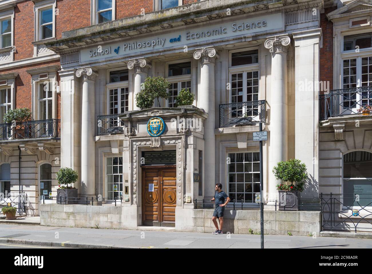 A solitary man stands outside the School of Philosophy and Economic Science in Mandeville Place ...