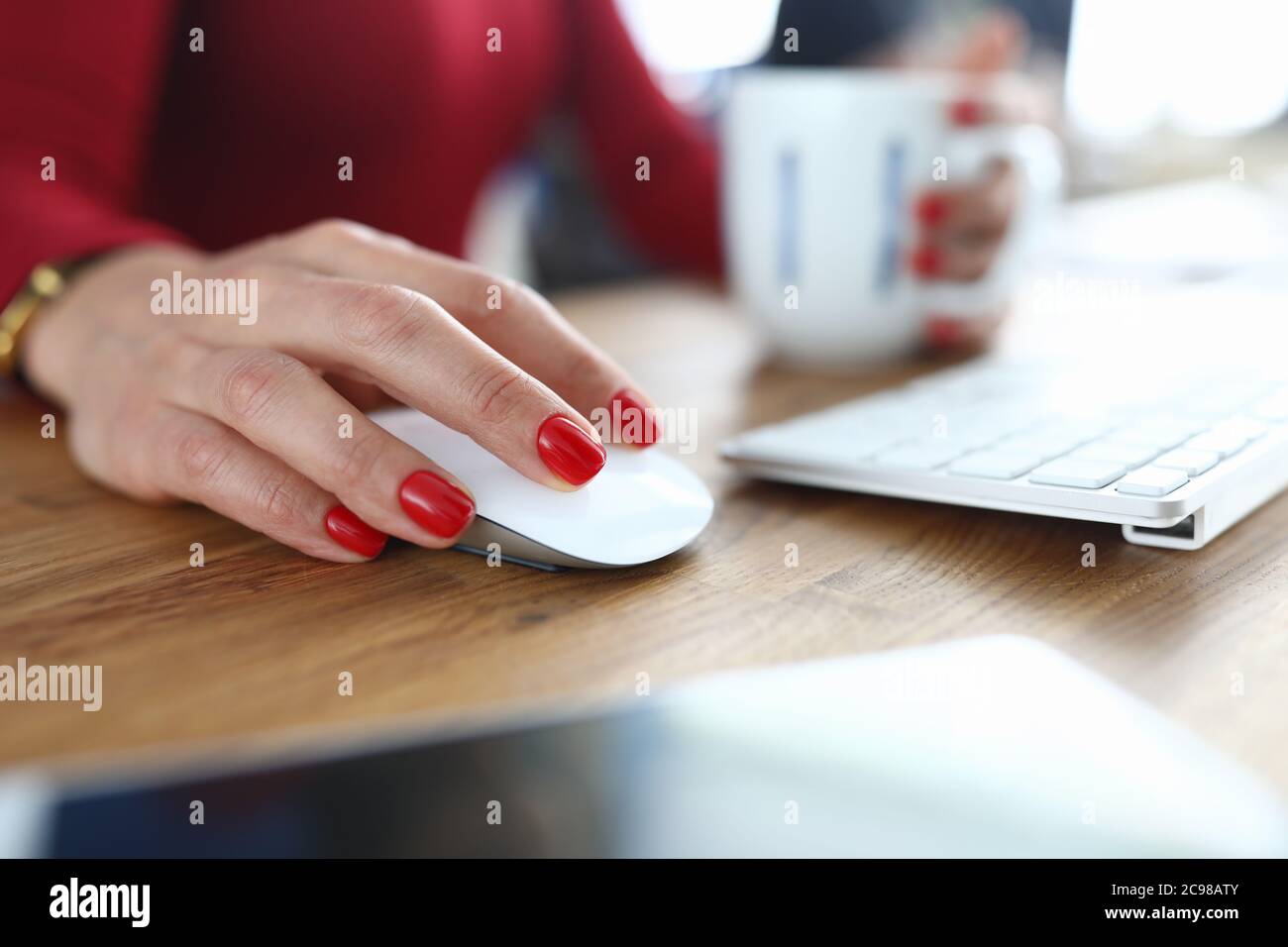 Hand office employee with red manicure on nails Stock Photo - Alamy