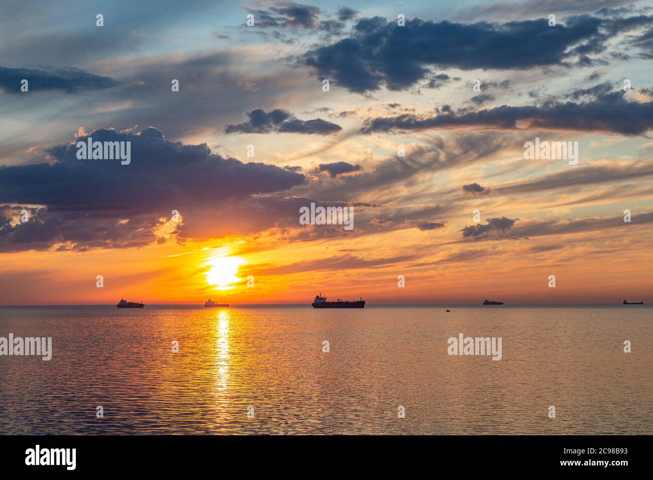 Beautiful sunset on sea ships hi-res stock photography and images - Alamy