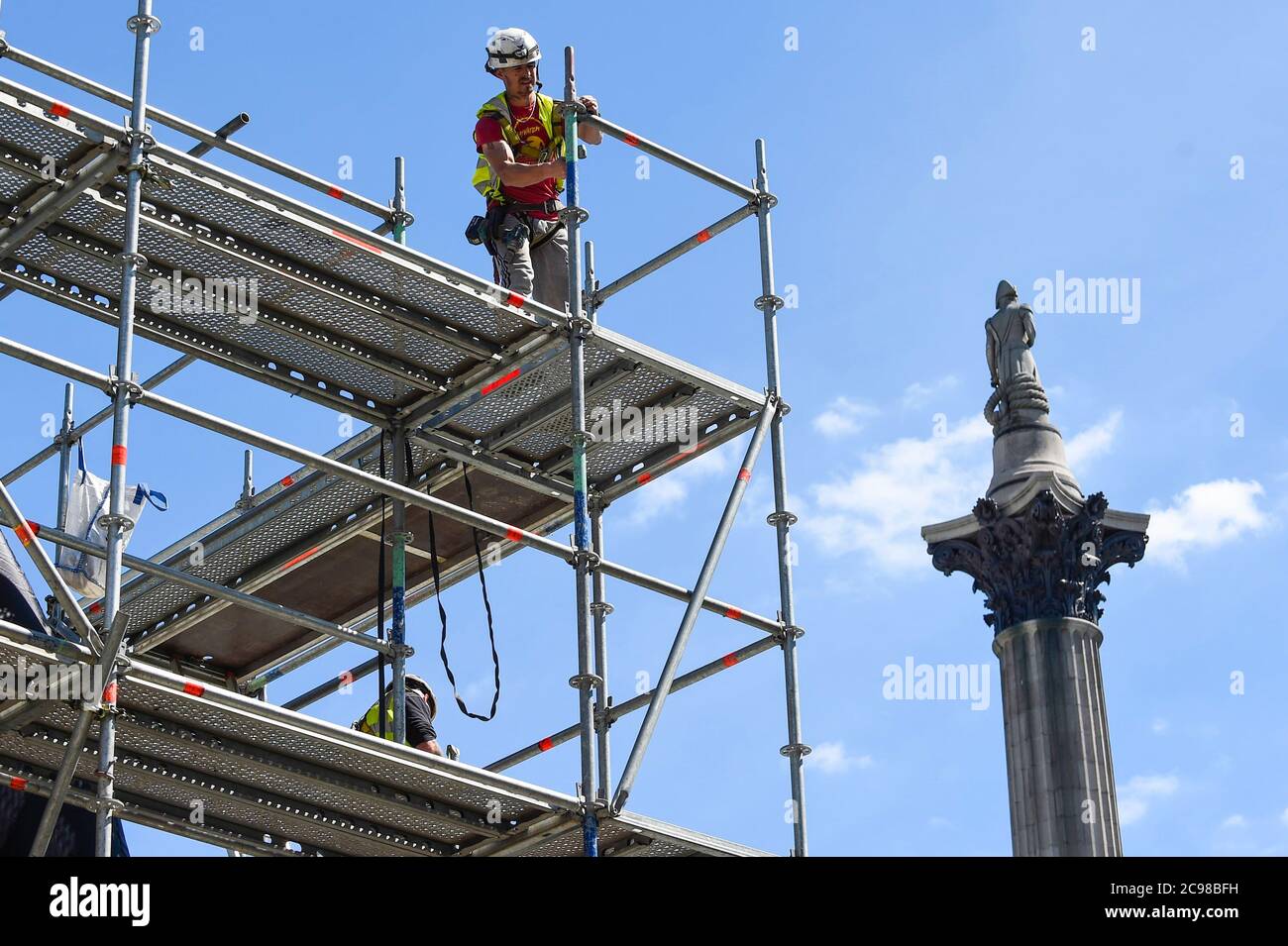 London, UK. 29 July 2020. Nelson's Column stands behind construction ...