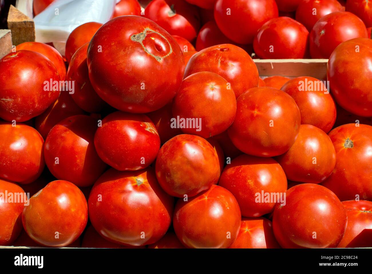 Nice ripe and tasty homemade tomato in a crate for sale. Tomatoes are ...