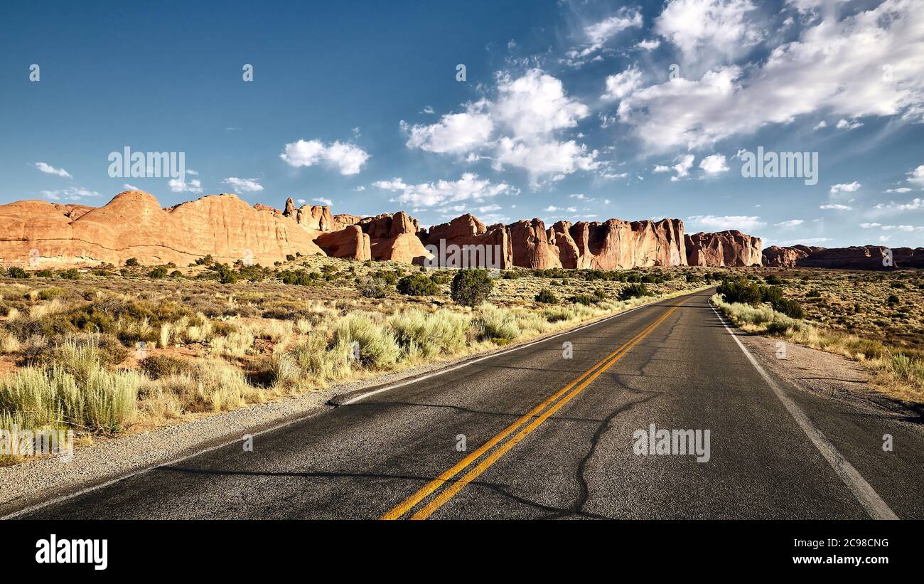 Beautiful scenery of a highway in a canyon landscape in Arches National ...