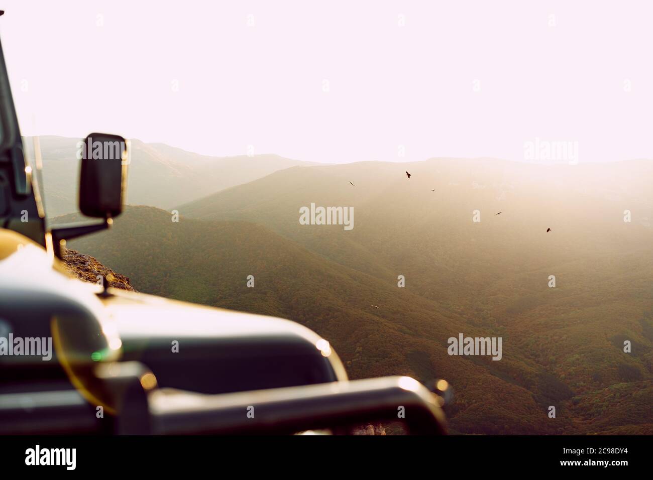 Dark green off-road car in the mountains Stock Photo - Alamy