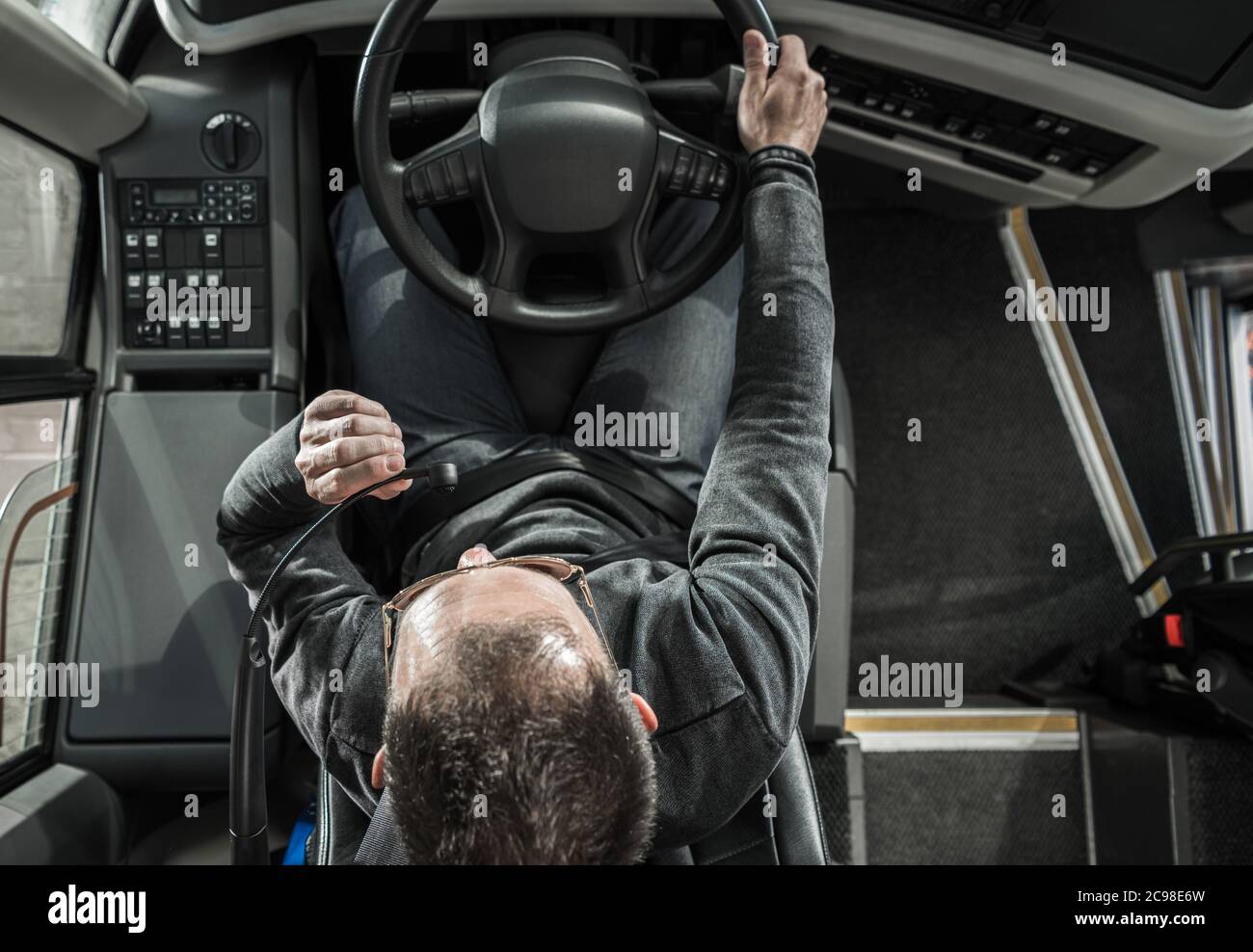 Public Transportation. Caucasian Coach Bus Driver in His 40s Behind the ...