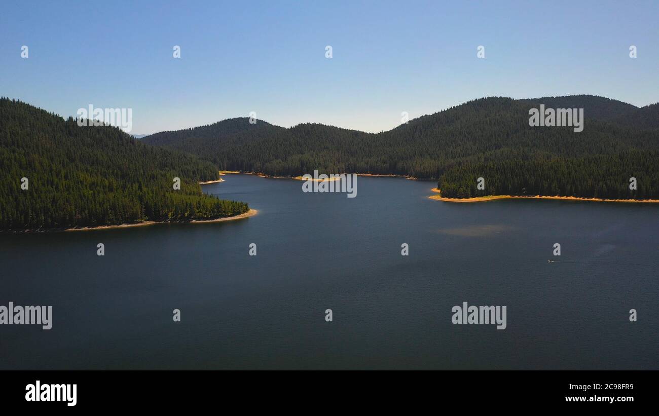 Aerial view of a blue ocean near a cliffy shore at daytime Stock Photo ...